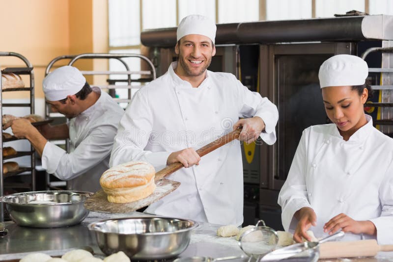 Team of Bakers Working Together Stock Photo - Image of indoors, making ...