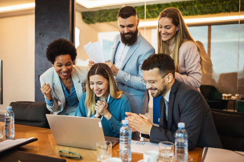 Group of Business People Working Together on a Laptop Stock Photo ... Group of Business People Working Together on a Laptop Stock Photo ...