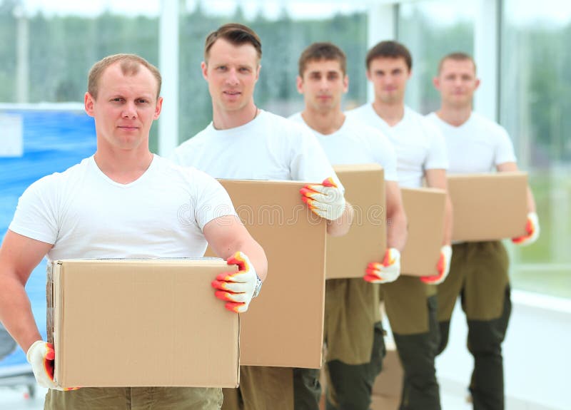 Team of Builders with Boxes of Building Materials Stock Photo - Image ...