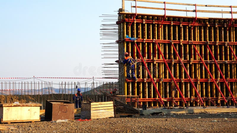 A Team of Builders Install a Formwork for a Concrete Wall Stock Footage ...