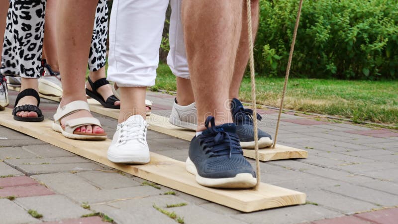 Team Building. Legs. Several People Walk on Two Boards Stock Video ...