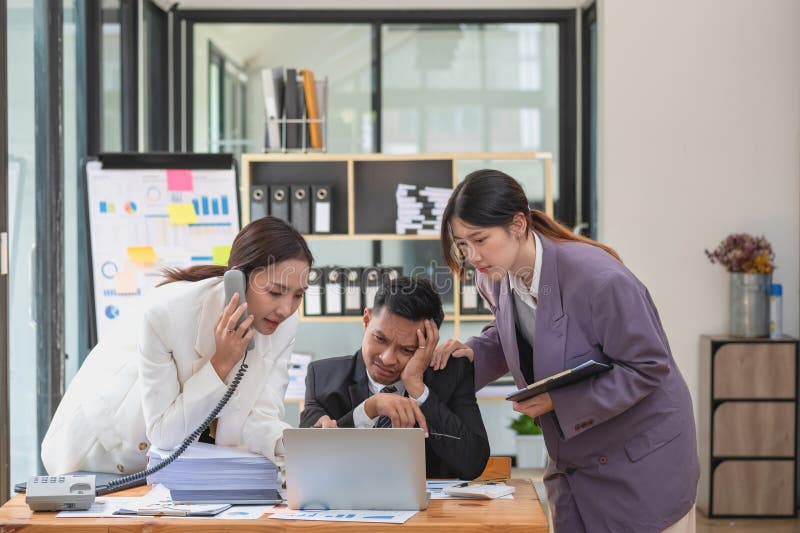 A Team of Business People are Busy Working on the Phone. Laptop ...