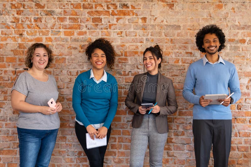 Team of Business People Smiling and Looking at Camera Stock Image ...