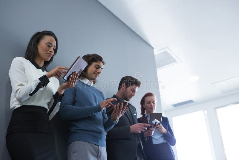 Team of Business People Using Electronic Devices Stock Photo - Image of ...