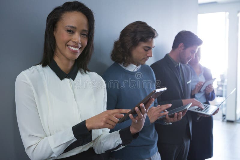 Team of Business People Using Electronic Devices Stock Photo - Image of ...