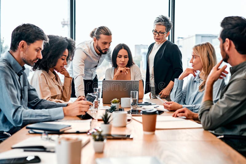A Team of Business People Working in a Modern Office. Stock Image ...