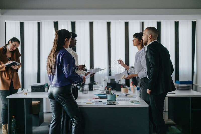 Group of Business Professionals Collaborating during an Indoor Office ...