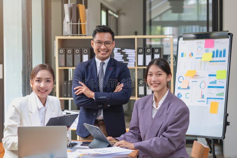 Team Business Three Smiling and Happy Asian Men and Women Team Using ...