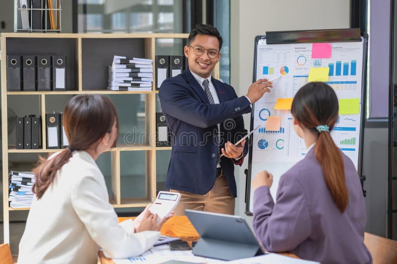 Team Business Three Smiling and Happy Asian Men and Women Team Using ...