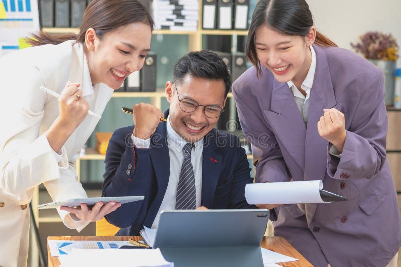 Team Business Three Smiling and Happy Asian Men and Women Team Using ...