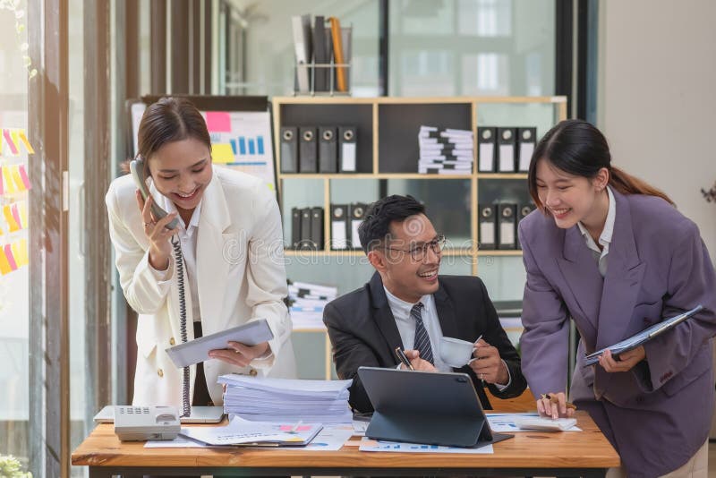 Team Business Three Smiling and Happy Asian Men and Women Team Using ...