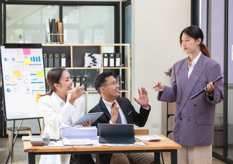 Team Business Three Smiling and Happy Asian Men and Women Team Using ...