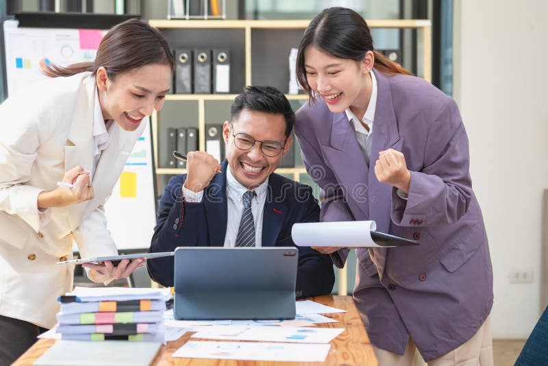 Team Business Three Smiling and Happy Asian Men and Women Team Using ...