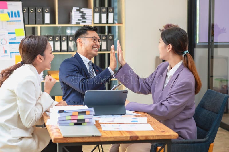 Team Business Three Smiling and Happy Asian Men and Women Team Using ...