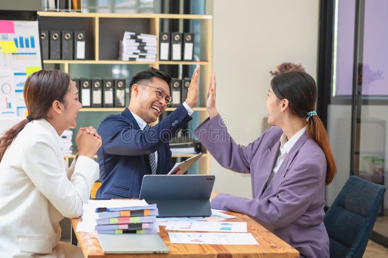 Team Business Three Smiling and Happy Asian Men and Women Team Using ...