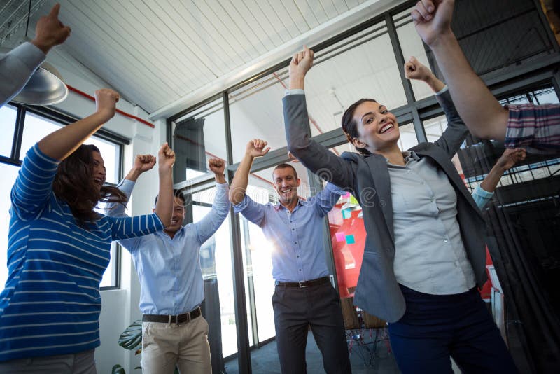 Team of Businesspeople Jumping in Office Stock Image - Image of happy ...