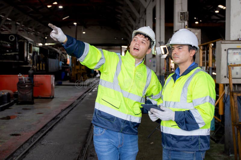 Team Caucasian Engineer Checking Train Looking Tablet in Station, Team ...