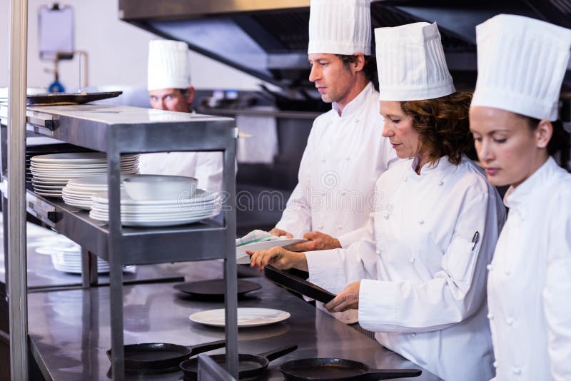 Busy Chefs at Work in the Kitchen Stock Photo - Image of sauce, dish ...