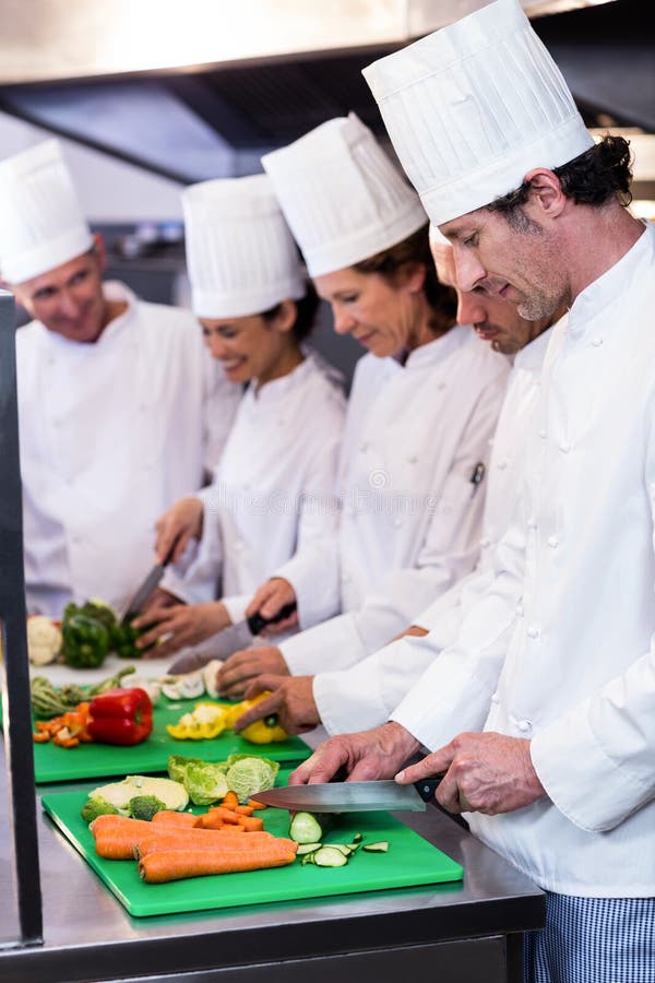 Team of Chefs Chopping Vegetables Stock Photo - Image of carrot ...