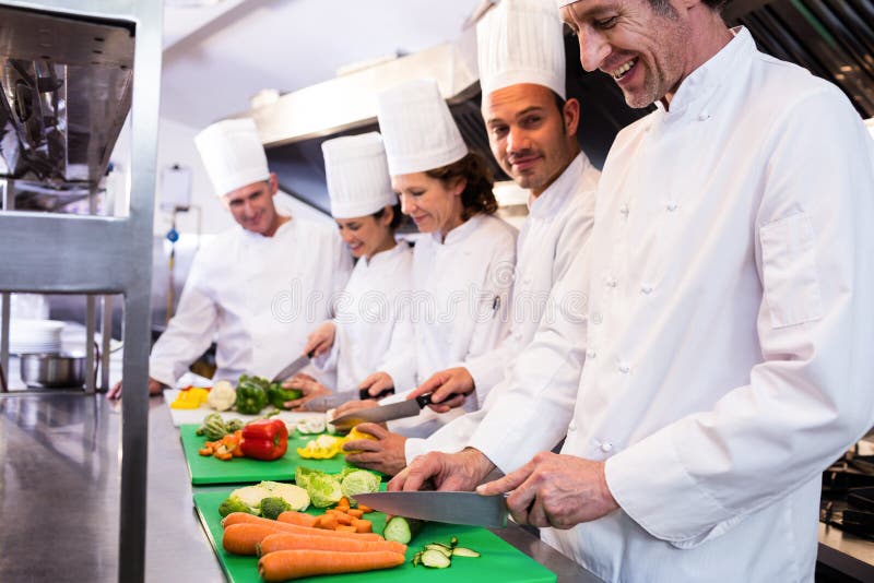 Team of Chefs Chopping Vegetables Stock Image - Image of cheerful ...