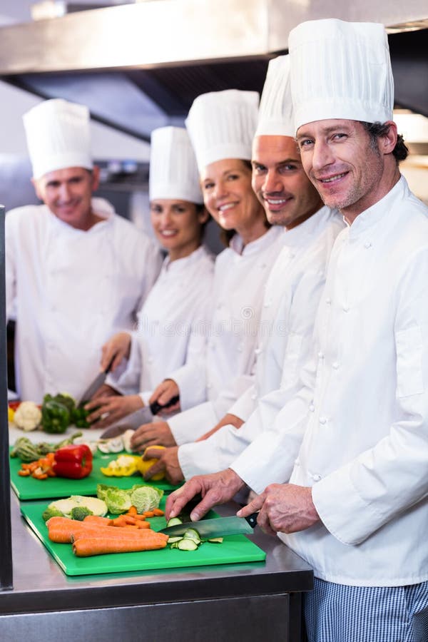 Team of Chefs Chopping Vegetables Stock Image - Image of five, knife ...