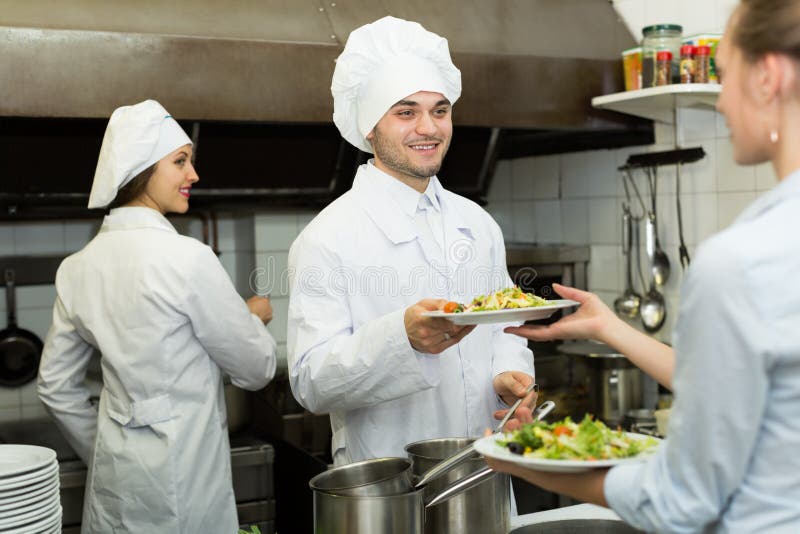 Team of chefs at kitchen stock image. Image of colleagues - 56773191