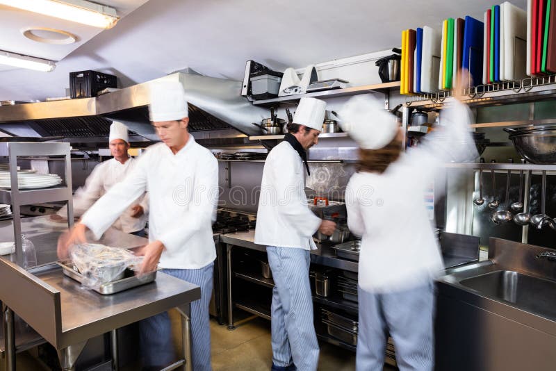 Busy Chefs at Work in the Kitchen Stock Photo - Image of sauce, dish ...