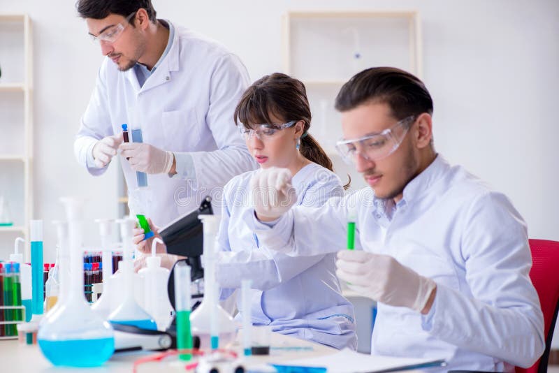 The Team of Chemists Working in the Lab Stock Image - Image of ...