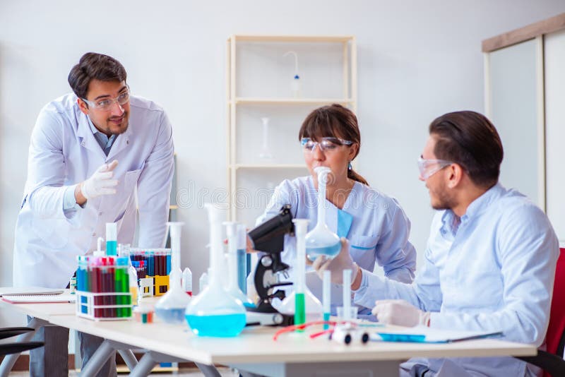 The Team of Chemists Working in the Lab Stock Image - Image of ...