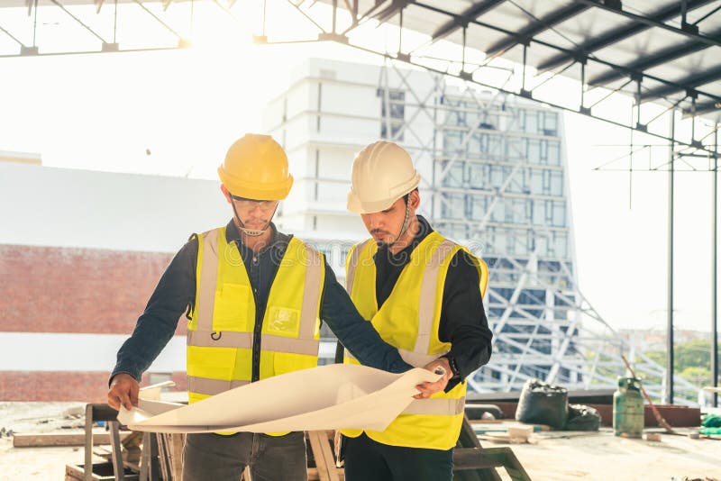 Team Civil Engineer Working with Blueprint Discussion Planning on ...
