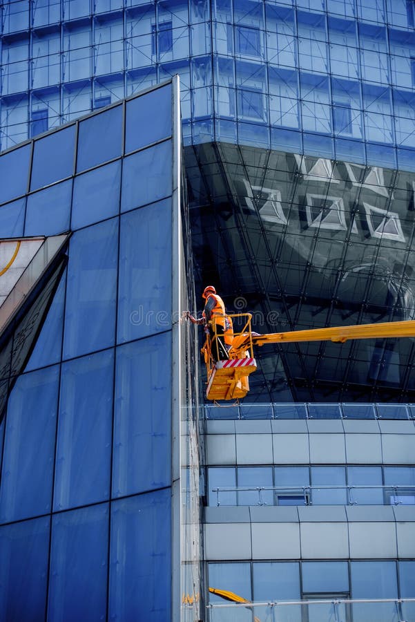 Maintenance Workers Climbing Outside A Skyscraper Stock Image - Image ...