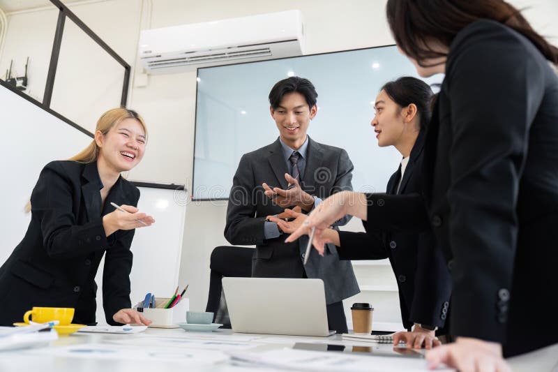 Team Collaboration and Business Discussion. a Dynamic Team Engages in a ...