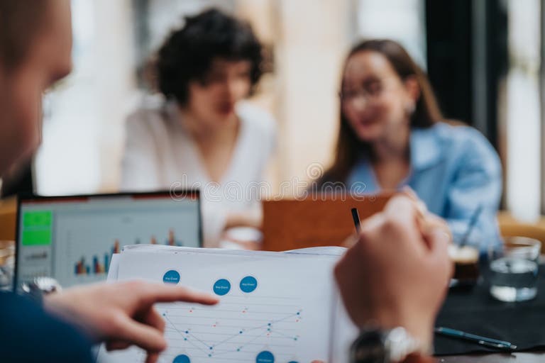 Team Collaboration during Business Meeting with Focus on Graph ...