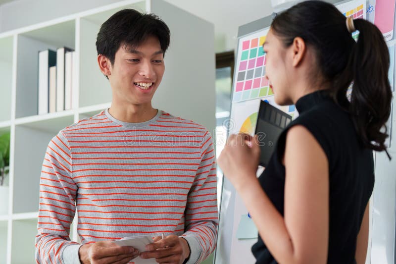 Team Collaboration and Creative Discussions. a Graphic Designer Shares ...