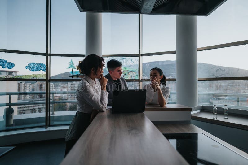 Team Collaboration in a Modern Office Setting with Large Glass Windows ...