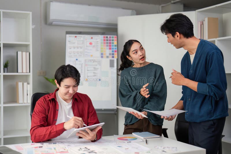 Team Collaboration in UIUX Development. Professionals Discussing Design ...