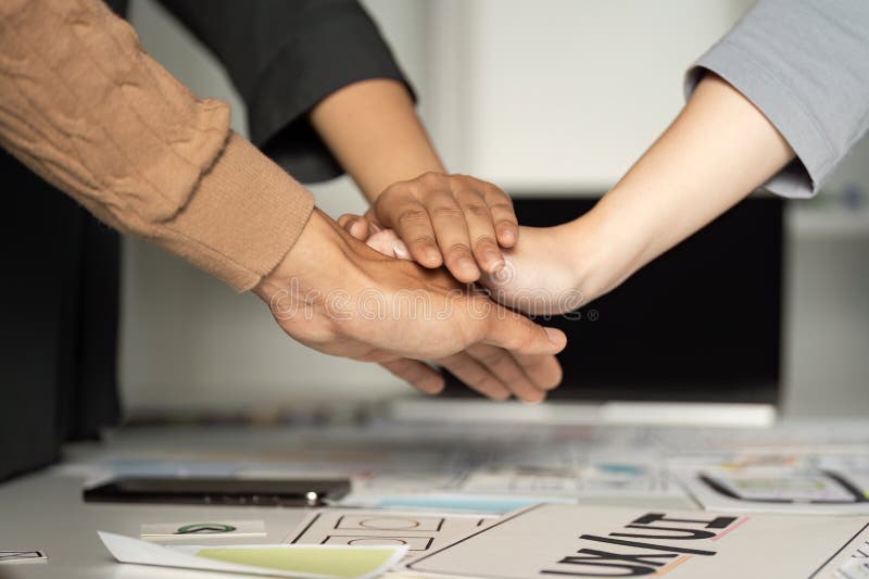 Collaborative Teamwork in UX UI Design Process with Hands Stacked Over ...