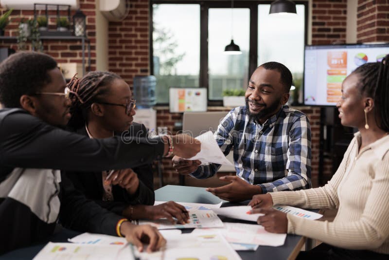 Team of Colleagues Analyzing Business Documents Stock Photo - Image of ...