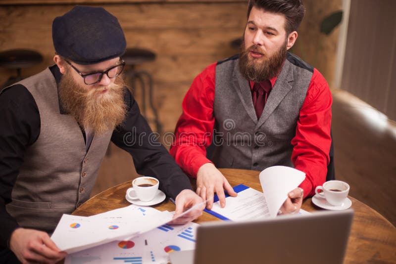 Team of Colleagues Working in the Pub and Using Technology Stock Photo ...