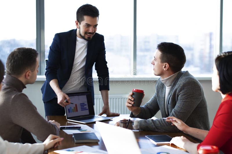 Team of Colleagues Working Together on a Project. Stock Image - Image ...
