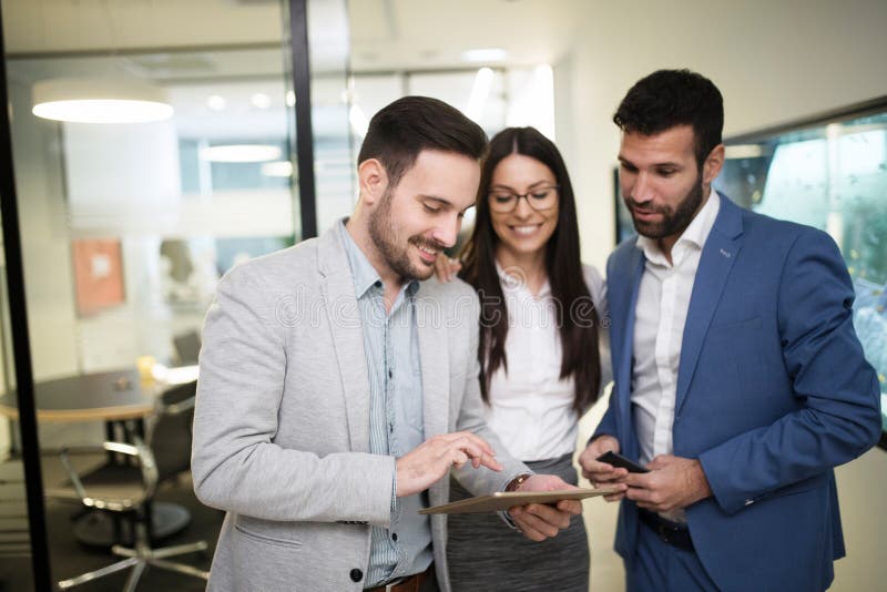 Team of Colleagues Working Together on Tablet Stock Photo - Image of ...