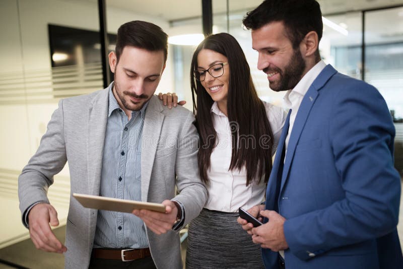 Team of Colleagues Working Together on Tablet Stock Photo - Image of ...