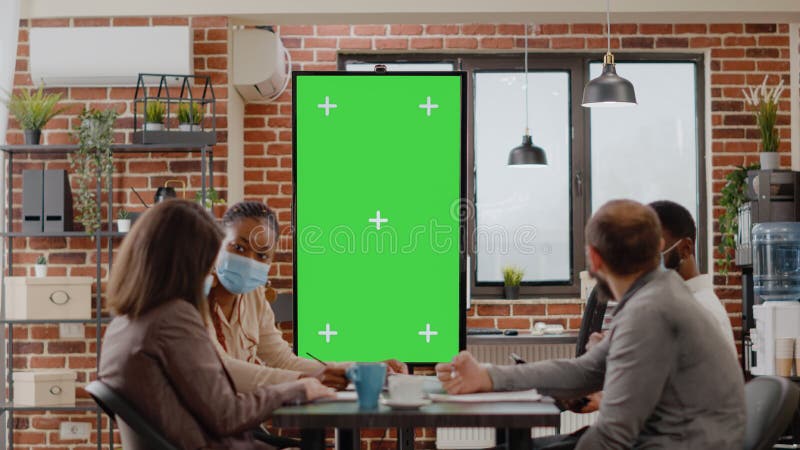 Team of Colleagues Working with Vertically Green Screen Stock Photo ...