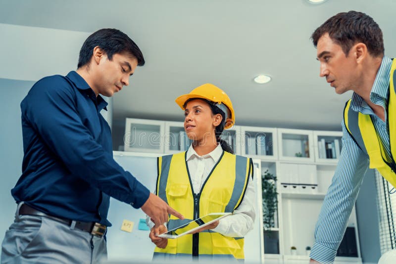 A Team of Competent Engineers Discussing with the Investor in the ...
