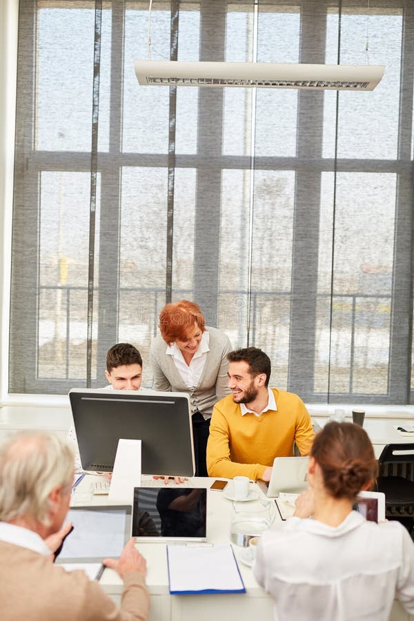 Team with Computer in E-learning Workshop Stock Photo - Image of ...