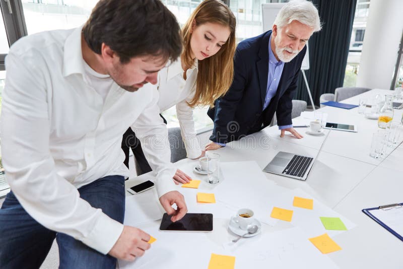 Team at Conference Table Planning Strategy Stock Image - Image of group ...