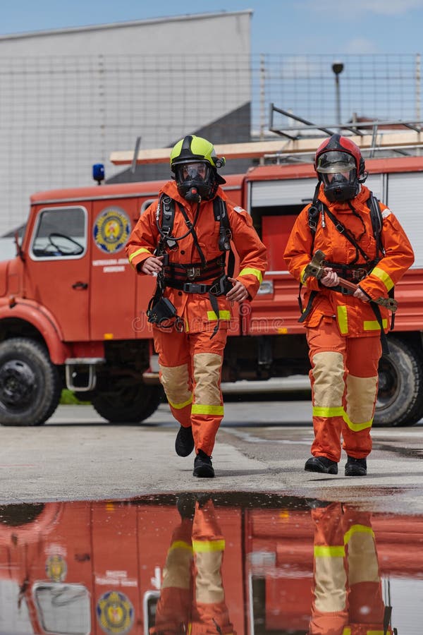 A Team of Confident and Accomplished Firefighters Strides Purposefully ...