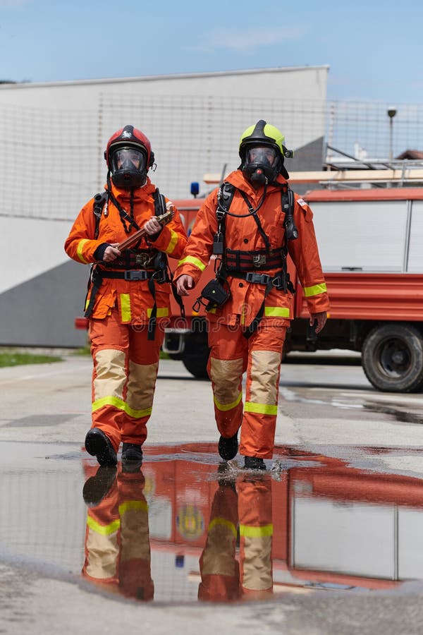 A Team of Confident and Accomplished Firefighters Strides Purposefully ...