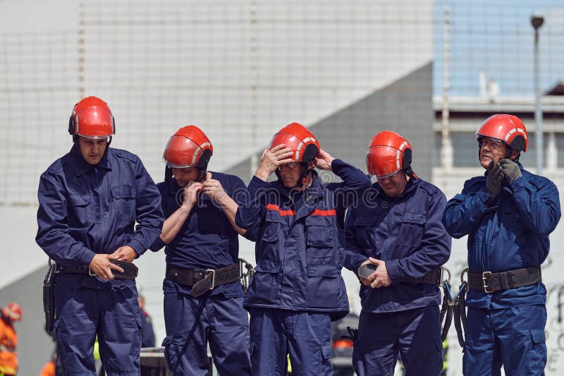 A Team of Confident and Accomplished Firefighters Strides Purposefully ...
