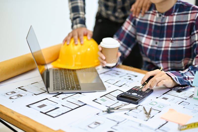 Team of Construction Engineer Working Together in the Office ...
